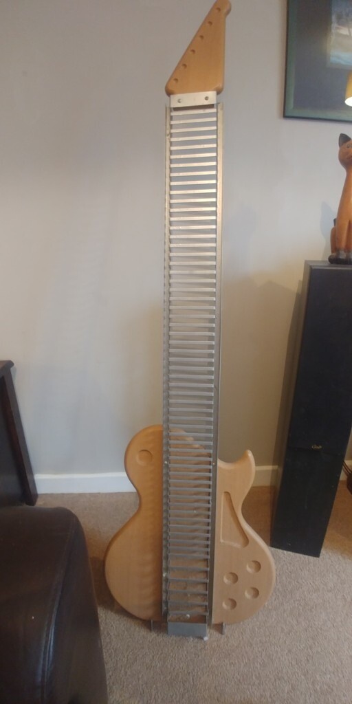 FREE STANDING CD HOLDER IN THE SHAPE OF A GUITAR MADE FROM WOOD AND ...