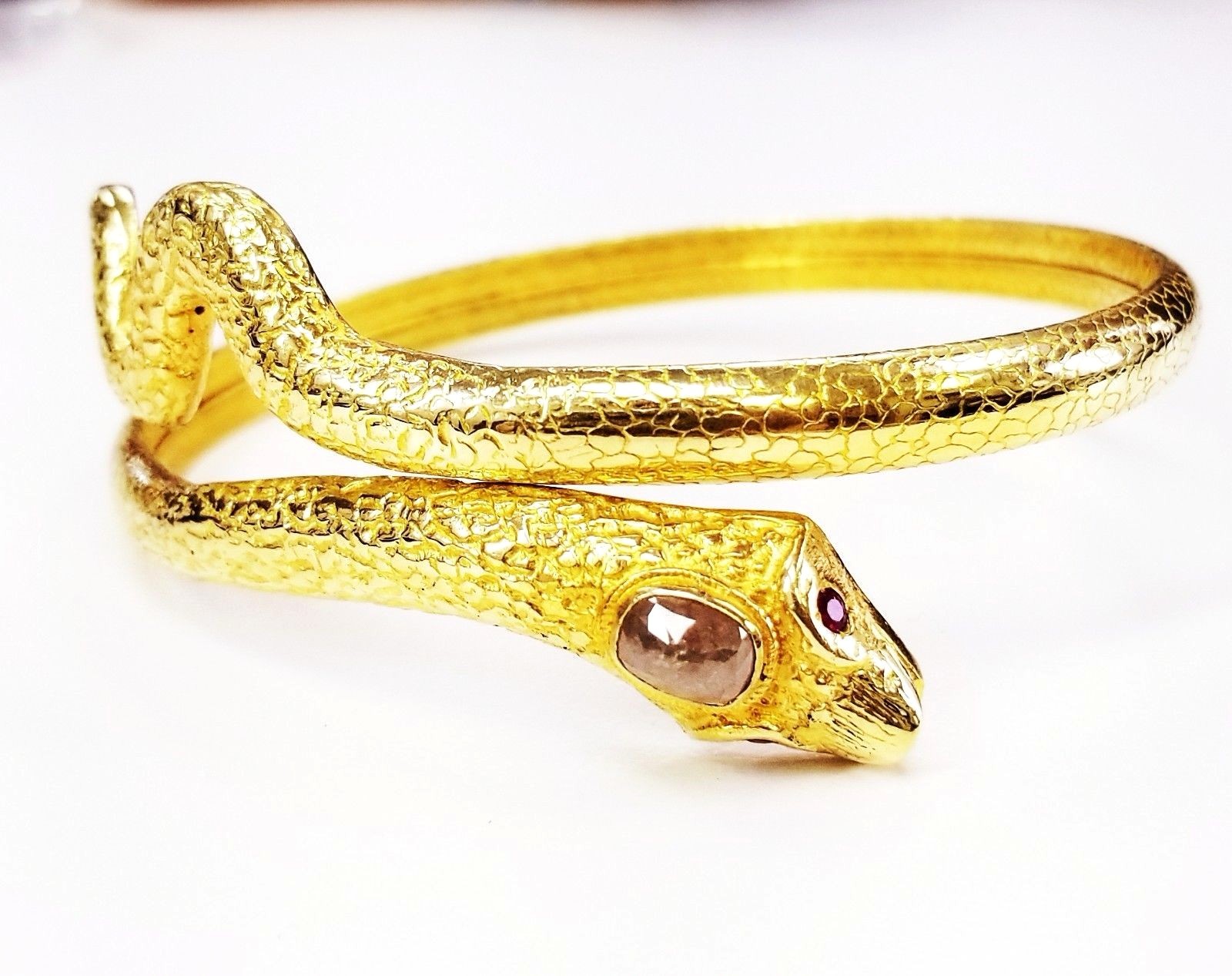 Gold snake bracelet with ruby eyes store