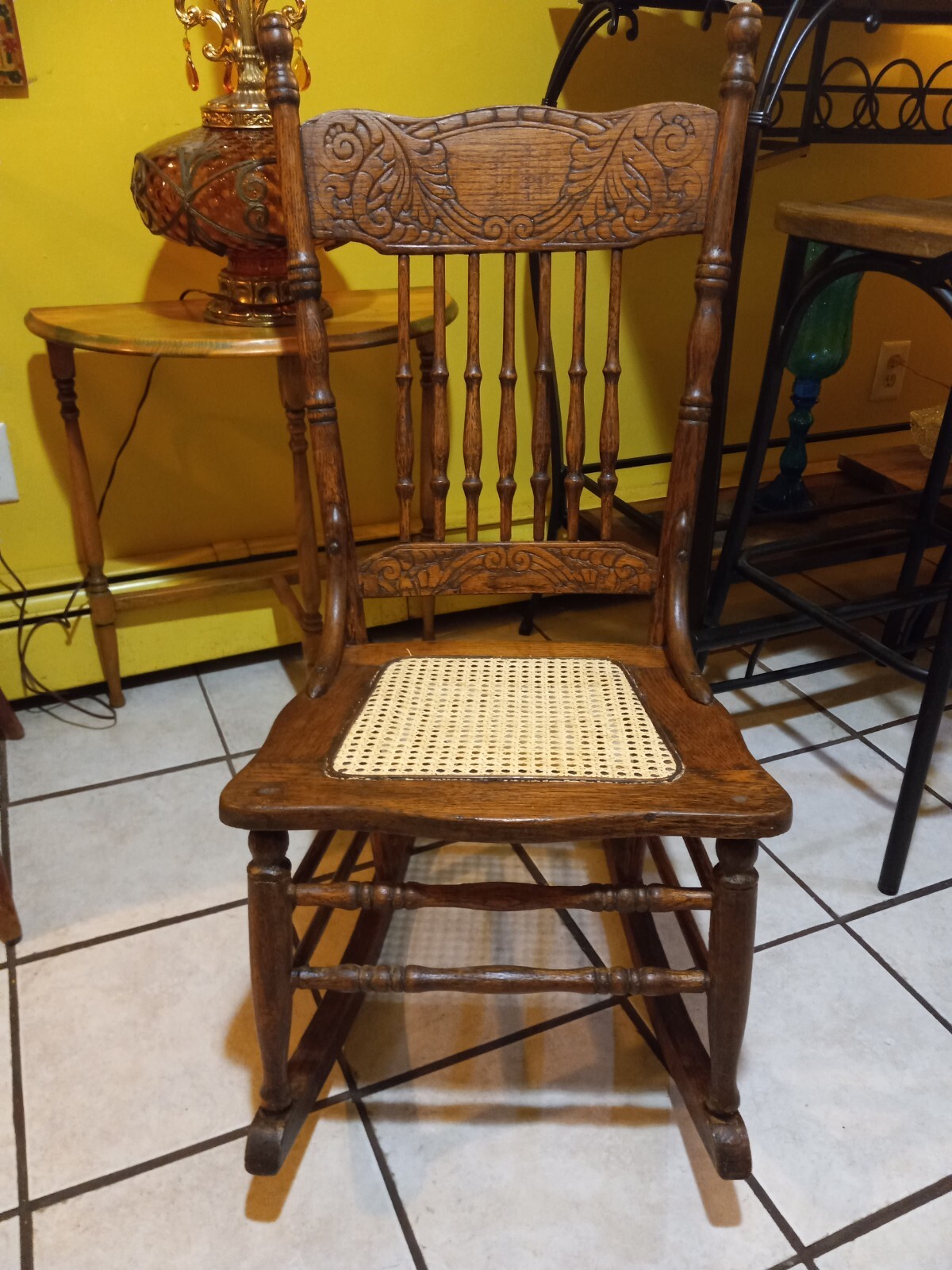 Spindles Cane Seat | Victorian Era Pressed Back Tiger Oak Rocking Chair