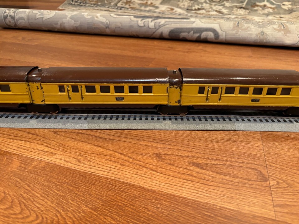 Rare pre-war Lionel train with track and transformer. Yellow and brown ...