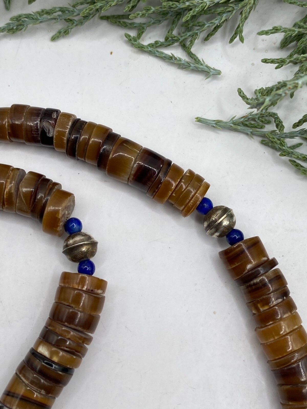 Native American golden brown penshell heishi bench be… - Gem