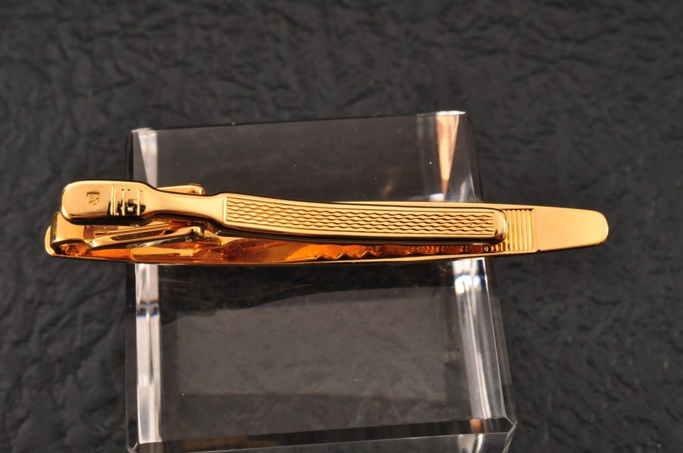 Near mint, "Dunhill" cufflinks and tie clip green and gold color brand ...