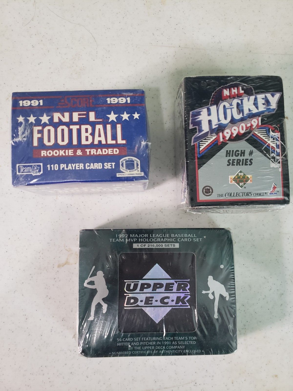 Lot of three Factory Sealed Trading Card Boxes. 1991 NFL/90-91 NHL/1992 ...