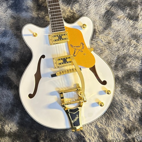 White semi hollow electric guitar gold hardware black fretboard vibrato ...