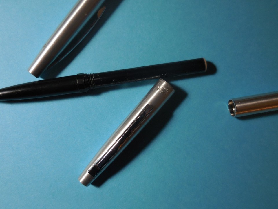 Two Pentel roller ball pens, brushed aluminum, replaceable plastic ...