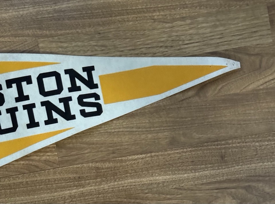 vintage Boston Bruins felt pennant featuring the iconic Spoked-B logo ...
