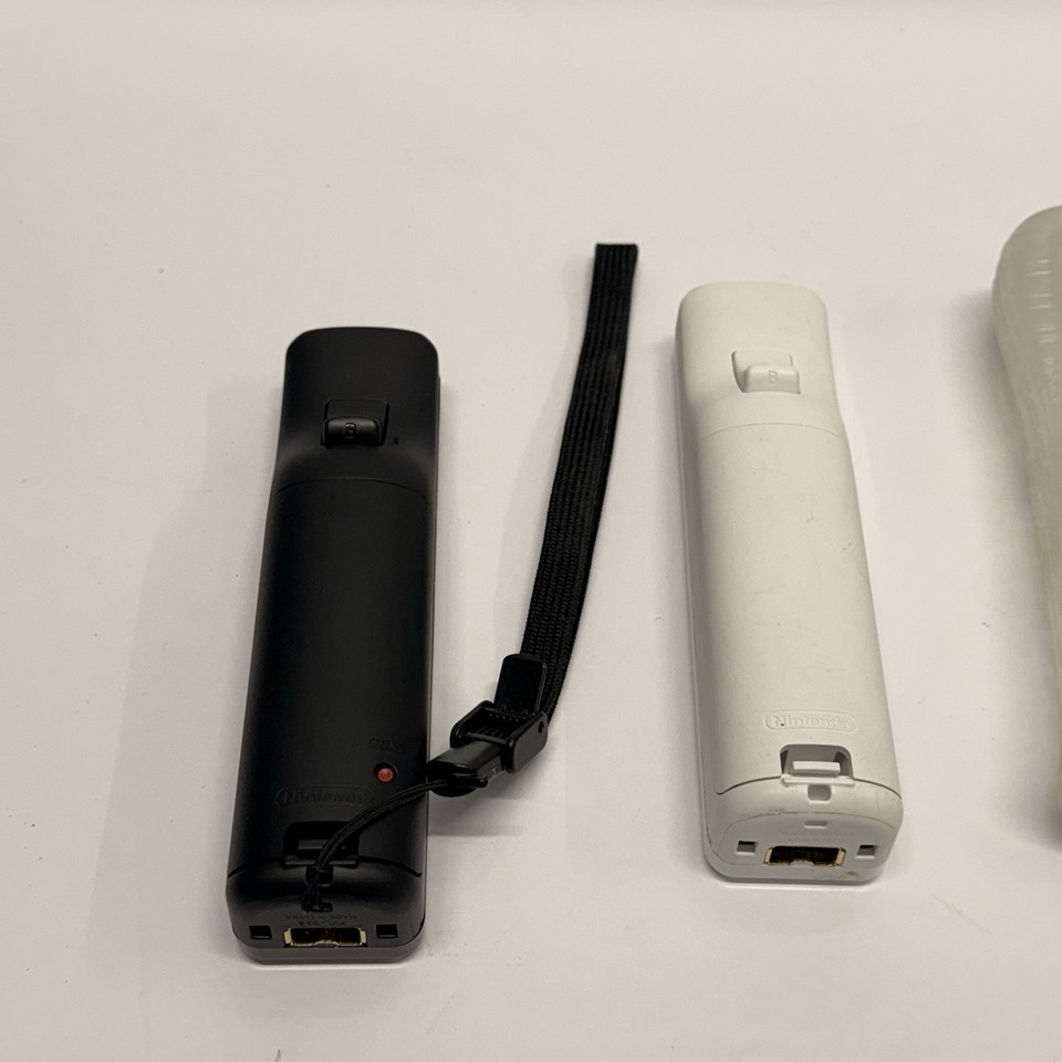 Pair Nintendo Wii Remote Plus controllers in black and white Both for ...