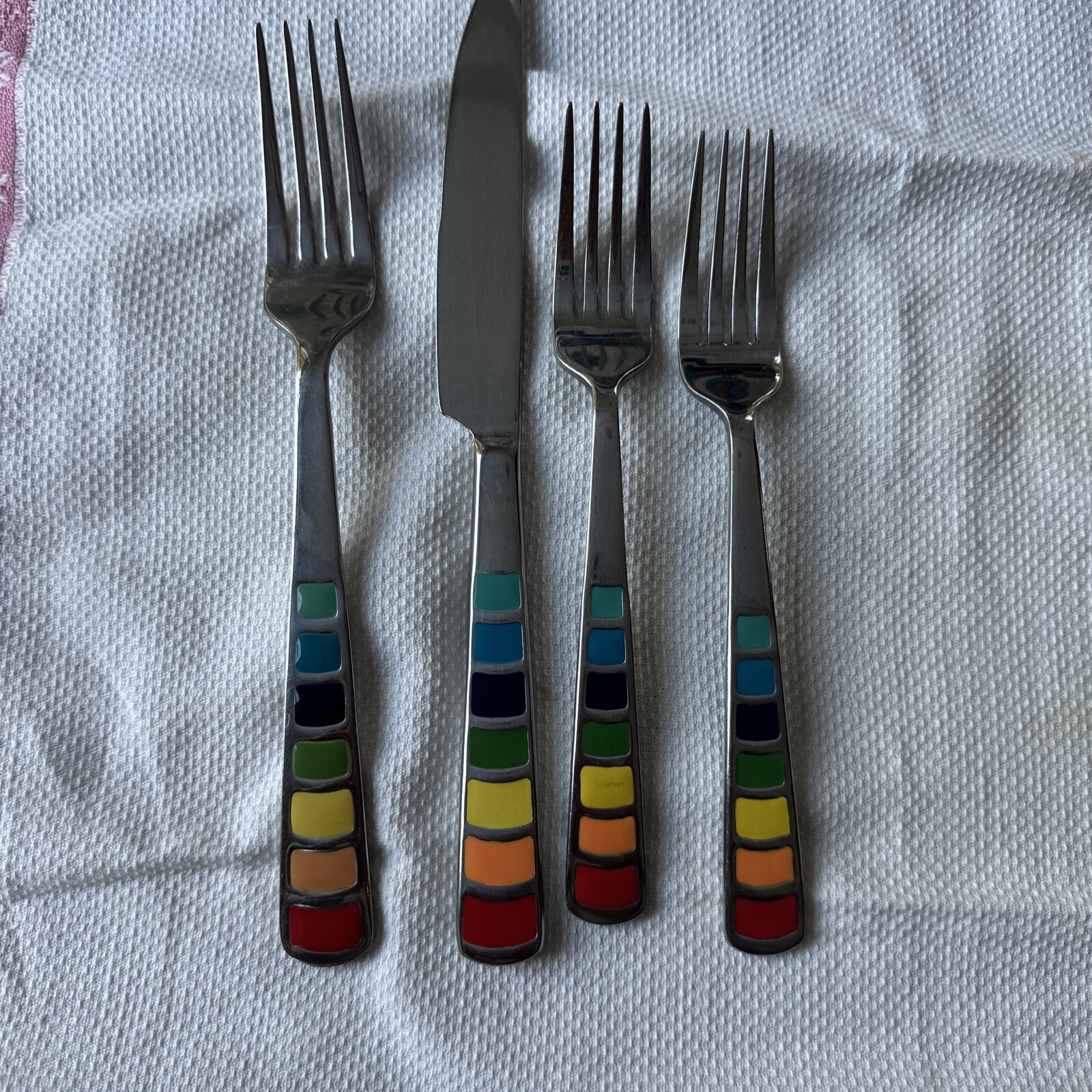 Lot of 4 pieces “FIESTA”flatware. 1 Dinner Fork, 2 Salad Forks, 1 Knife ...