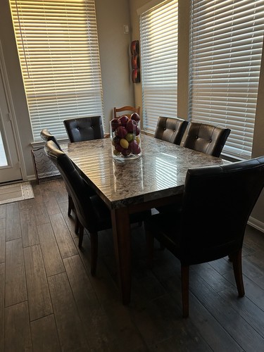 List at $325 Dining room. Marble top table with six chairs in good ...