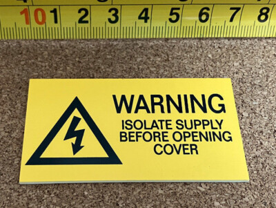 WARNING ISOLATE SUPPLY BEFORE OPENING COVER Label Self Adhesive 65x35mm ...
