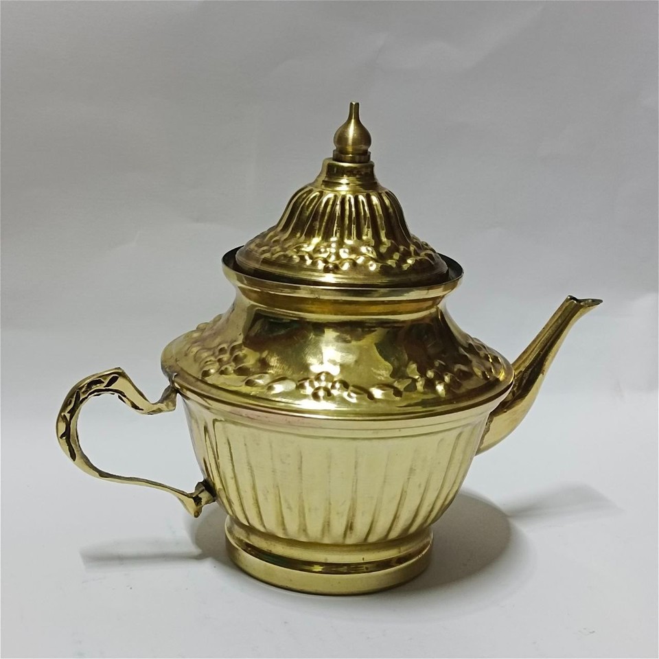 Vintage brass teapot with ornate detailing classic antique décor ...
