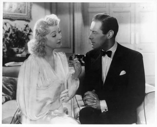 Kay Hammond speaks to Rex Harrison a scene film Blithe Spirit 1945 Old ...