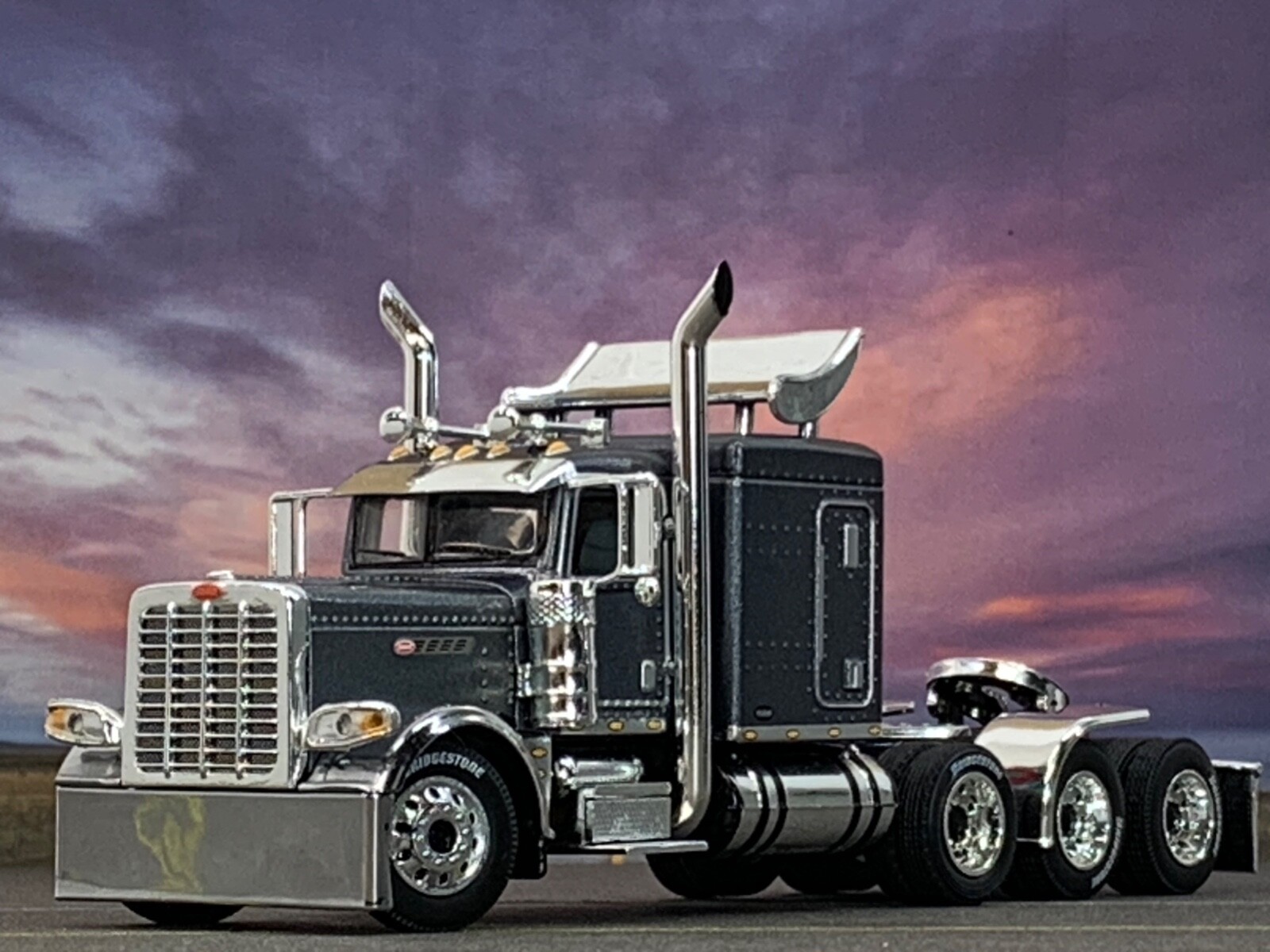 1/64 DCP GUN METAL PRIDE & CLASS PETERBILT 389 TRI AXLE FLAT TOP W ...