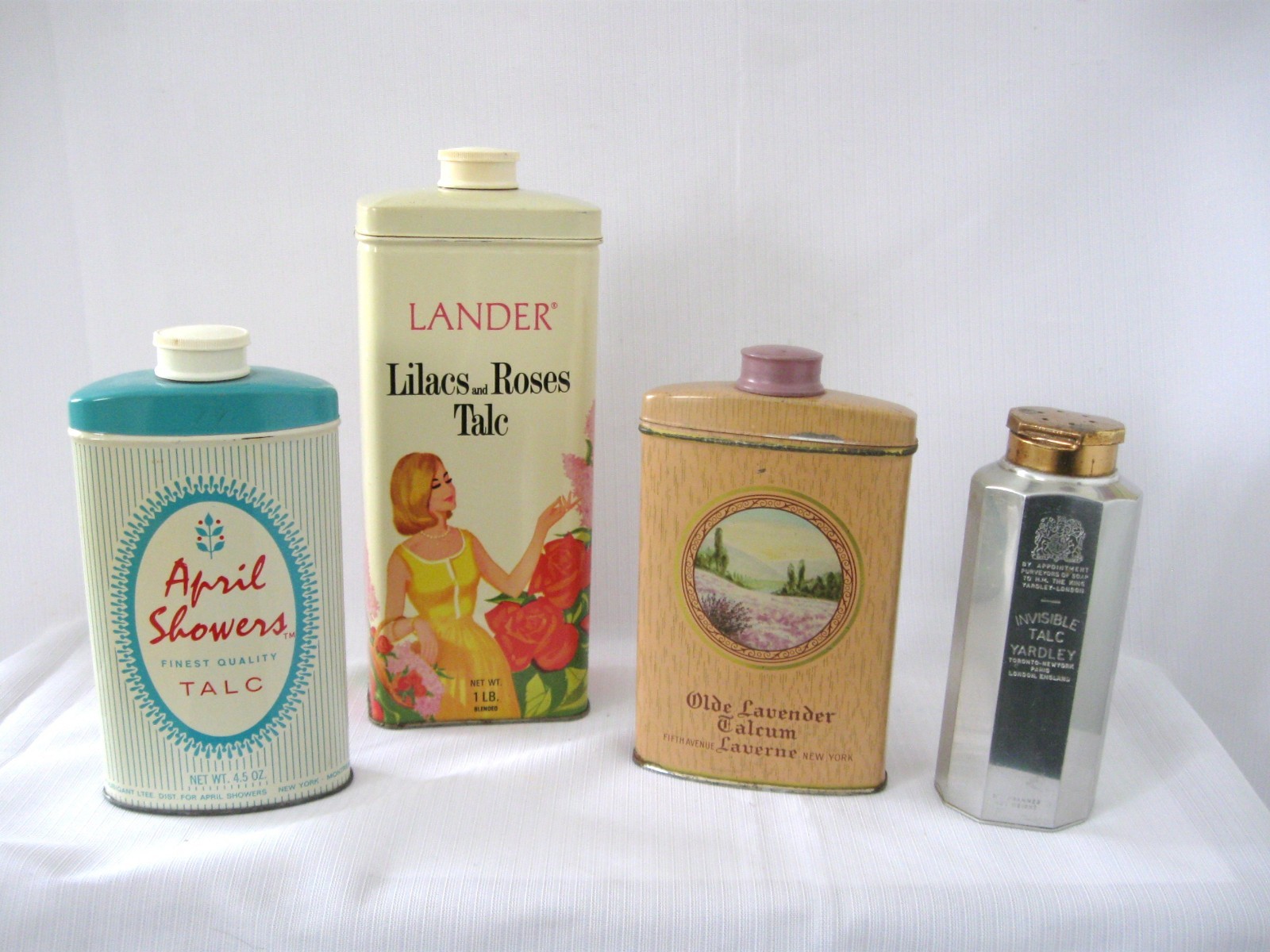 FOUR VINTAGE BODY TALC POWDER TINS ..YARDLEY/LAVERNE/HOUBIGANT /LANDER ...