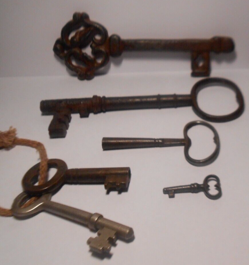 7 Old Door Keys 1x primitive repair wheels 2x 5" a 1" key 1x Clock key ...