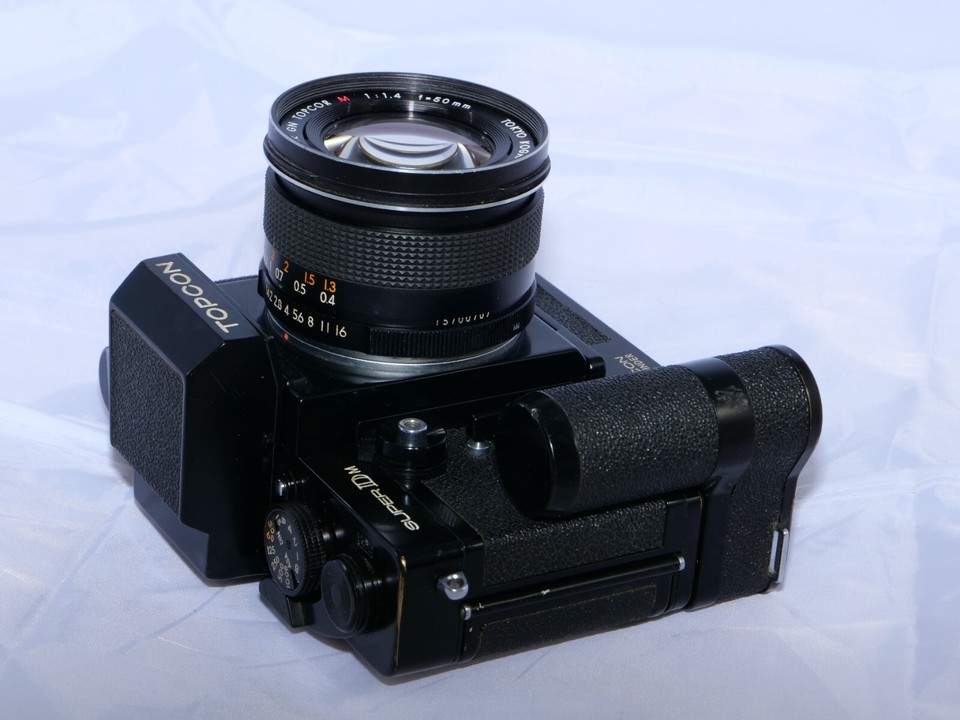Topcon Super DM black camera. GN-Topcor 50mm f1.4 lens. Topcon Auto ...
