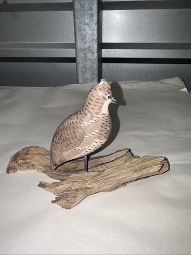 Quail or partridge - hand carving on a wooden base. The legs are made ...