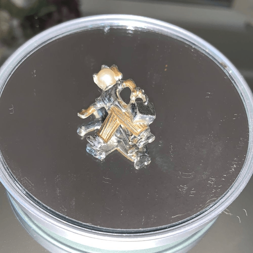 Vtg small silver brooch/pin of man walking with suitcase or briefcase ...