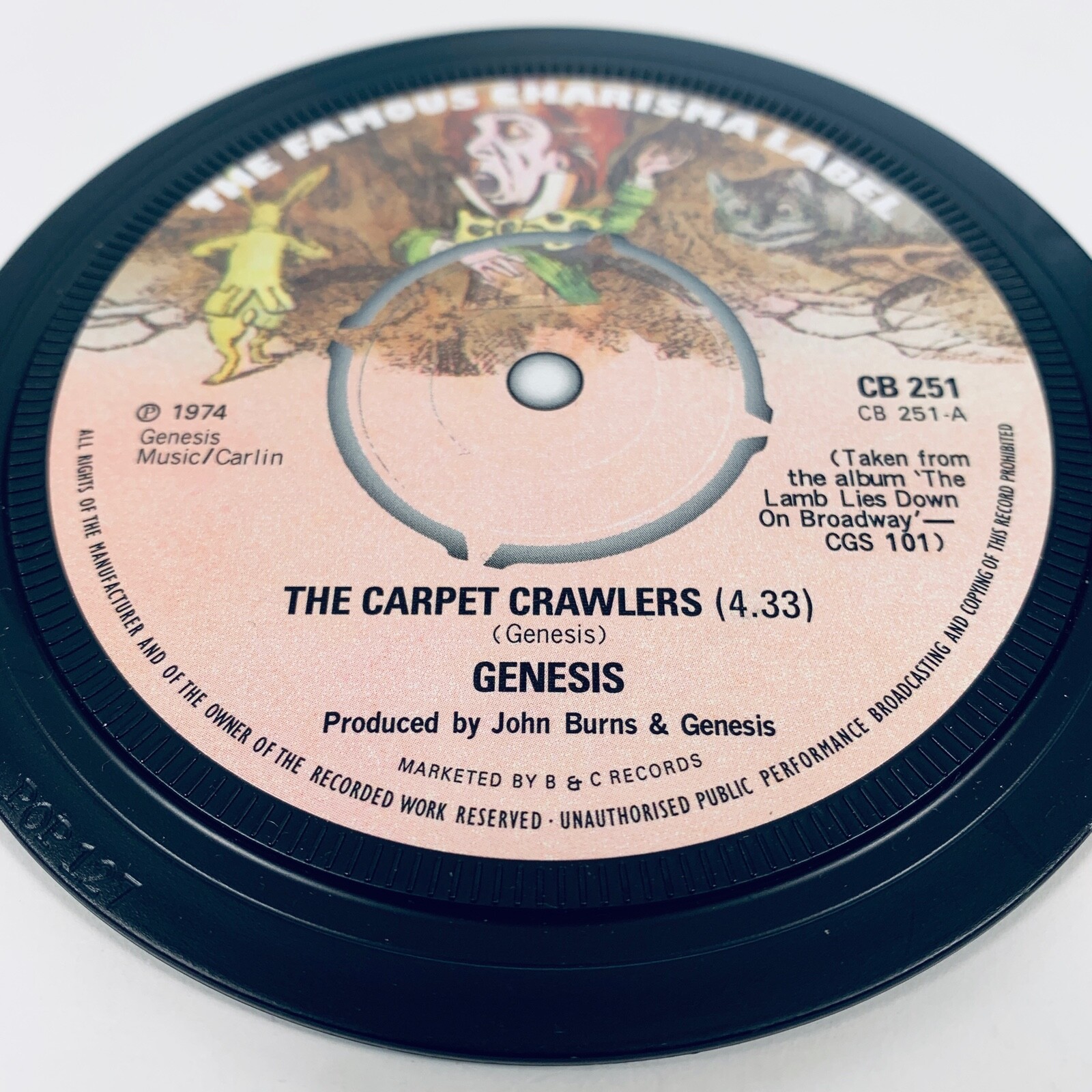 Genesis. Record label coaster. The Carpet Crawlers. Charisma Records ...