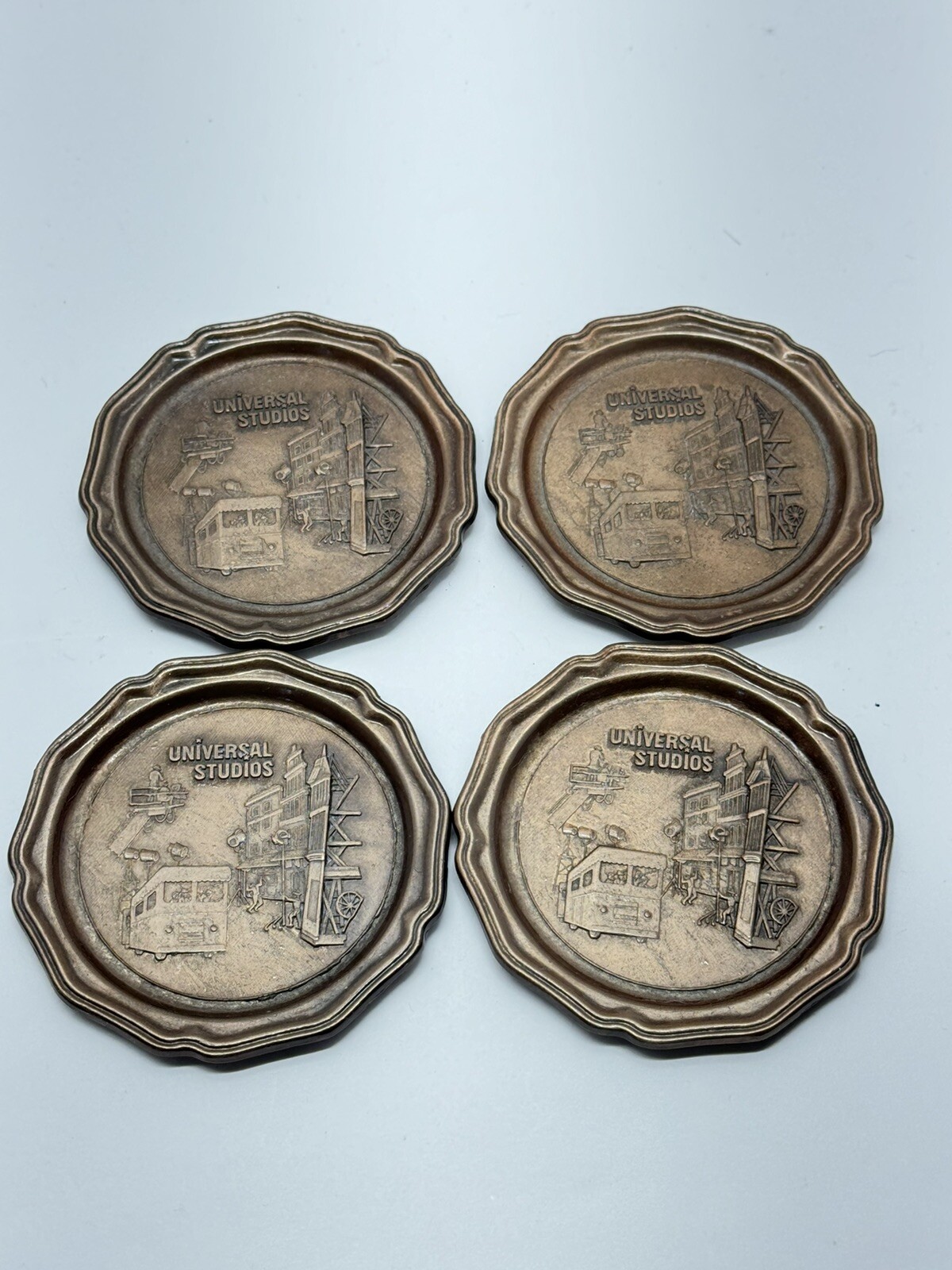 Vintage Metal Universal Studios Coasters Set Of 4 Bronze Made In USA | eBay
