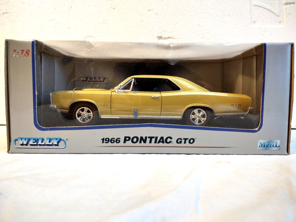 Welly 1966 Pontiac GTO Model Car 1:18 Scale Diecast Gold 2111 New In ...