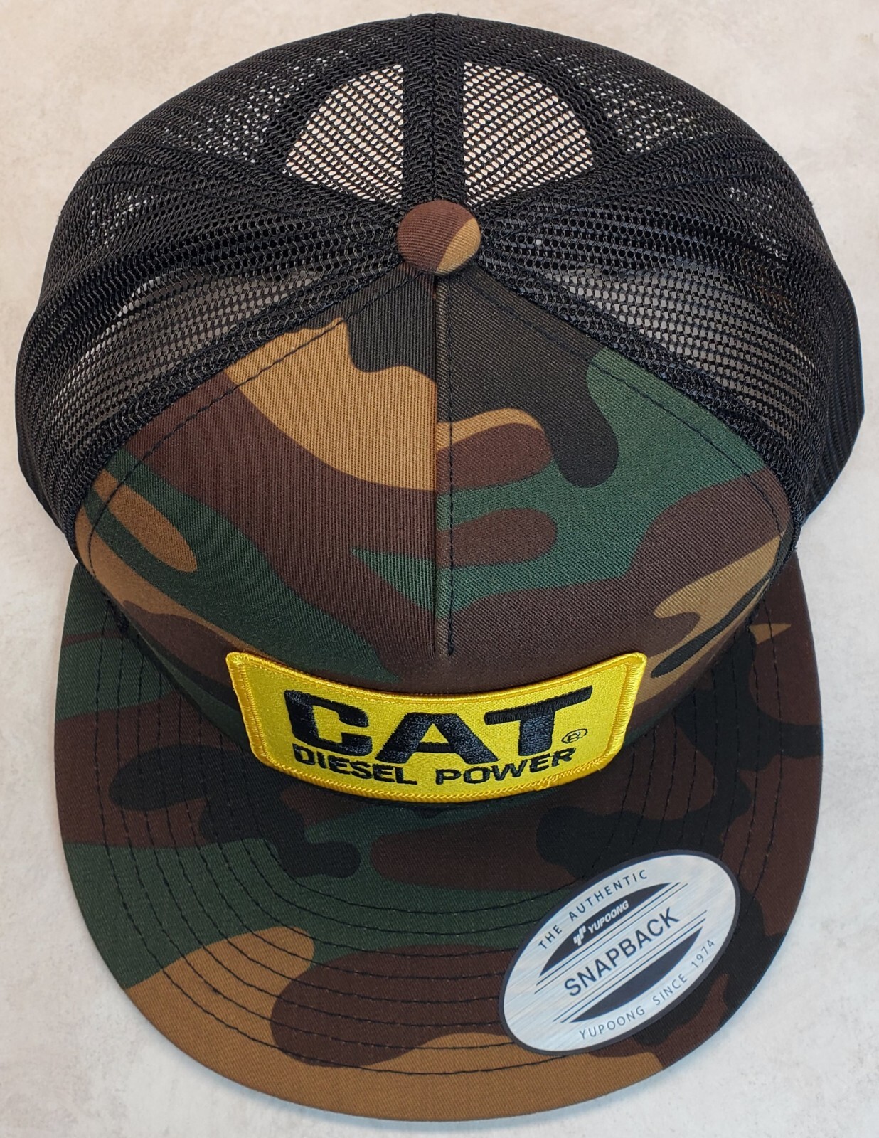 CAT DIESEL POWER Patch on Yupoong Trucker Hat / YP Classic 6006 Camo ...