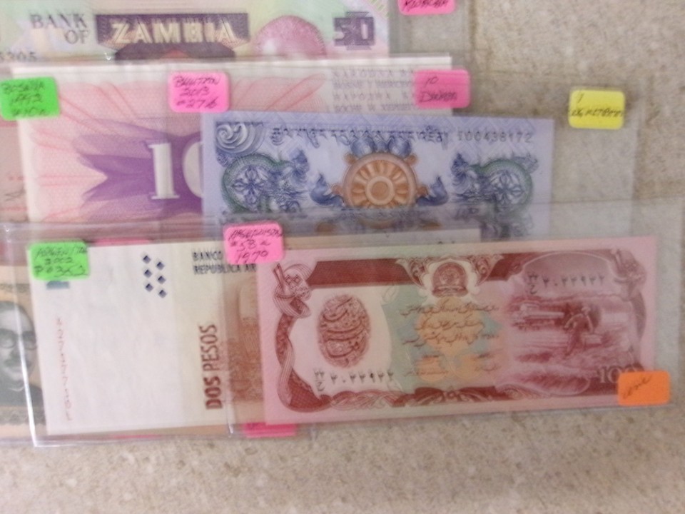 1 Lot of 12 Foreign Bank Notes in Uncirculated Condition with Sleeves ...