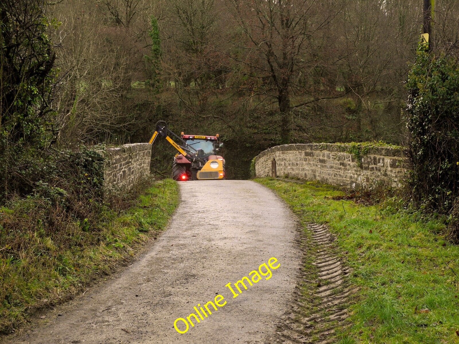 Photo 12x8 A hedge cutter crosses Mill Bridge on the river Yeo ...