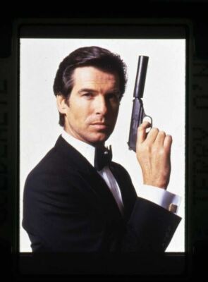 Pierce Brosnan Goldeneye James Bond Gun with silencer pose Original ...