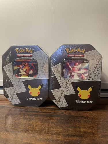 Pokemon TCG Celebrations Lance's Charizard & Dark Sylveon Tins (Set Of ...