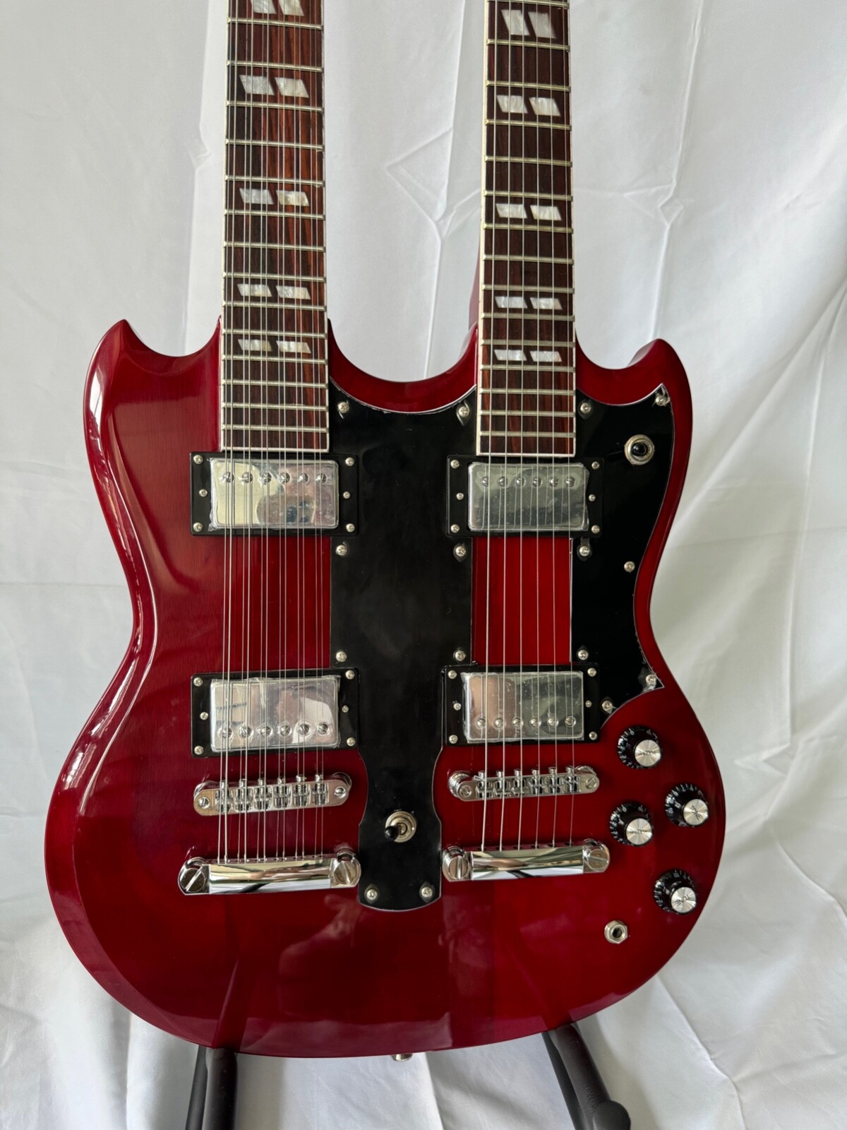 Double headed bright red electric guitar, perfect, made of peach ...