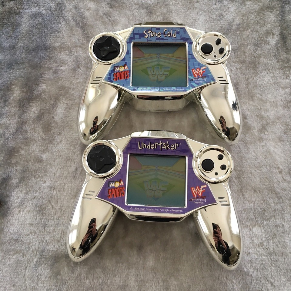 Vtg 1999 WWF Stone Cold Vs. Undertaker Hand Game Controllers MGA Sports ...