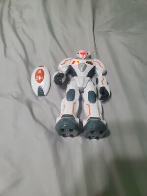 2004 White Toy Robot - Lights Up, Walks with Battle Shooting Sounds ...