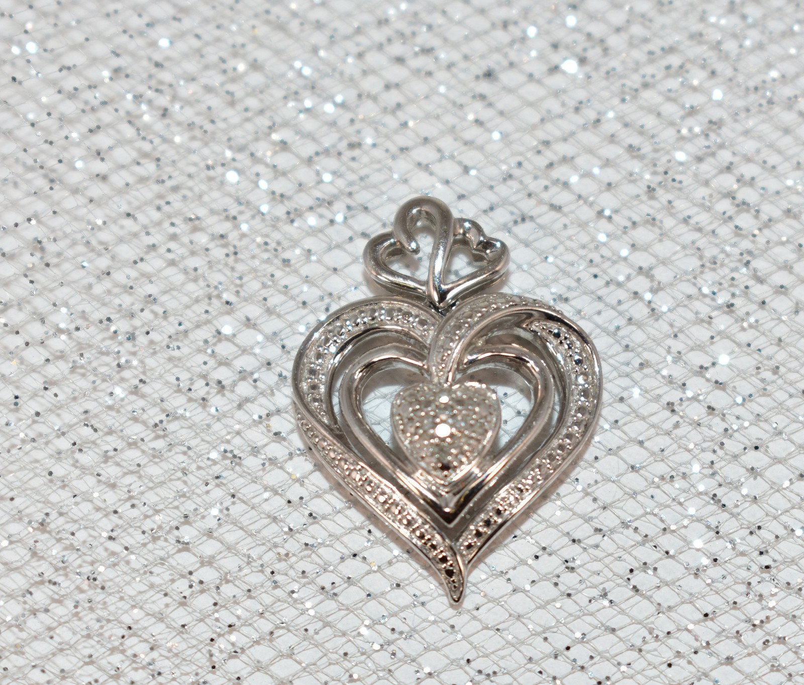 Sterling Silver .05 CT TCW White Diamond Accents Quintuple Heart ...