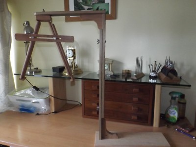 Repairers cuckoo clock stand for final adjustments testing time chimes ...