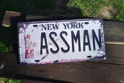 New York ASSMAN Novelty License Plate Tin Sign - Jerry Seinfeld - Cosmo ...