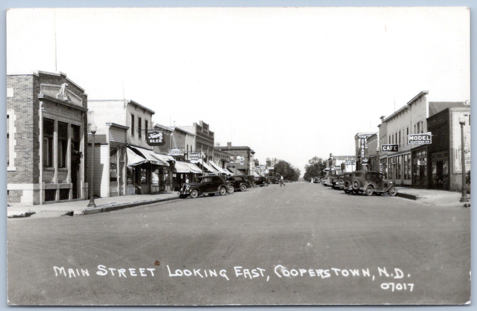 Postcard RPPC Cooperstown ND Main St Looking East Hamms Beer Bank Cars ...