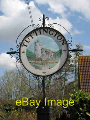 Photo 6x4 Tuttington village sign The village sign depicts the church ...