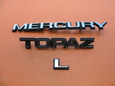 88 89 90 91 92 93 94 MERCURY TOPAZ L REAR LID EMBLEM LOGO BADGE SIGN ...