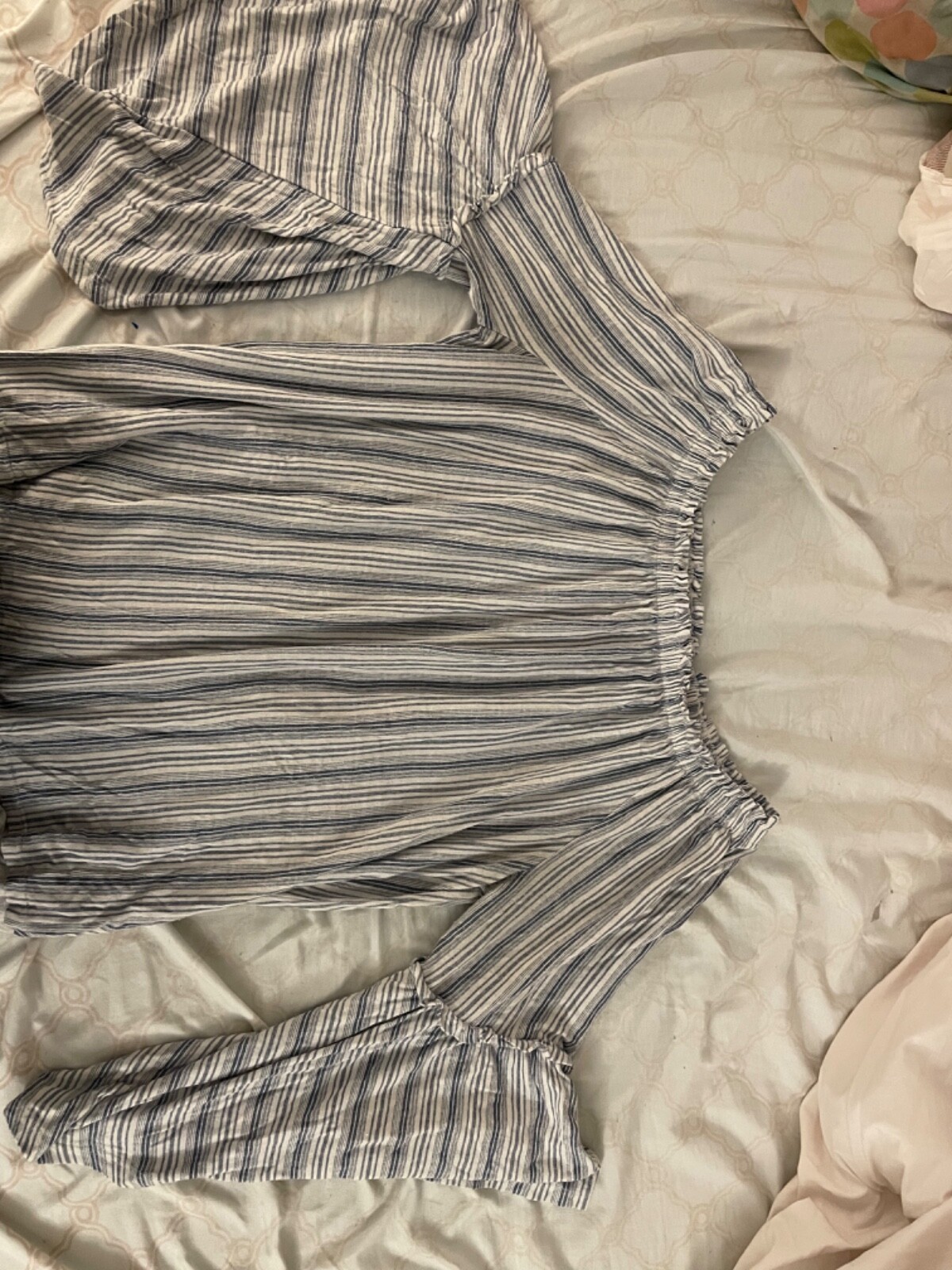Blue and white toned, vertical striped, flowy top, small ruffle on ...