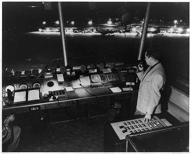 Chicago,control tower operator,OHare Field presses button,regulate ...