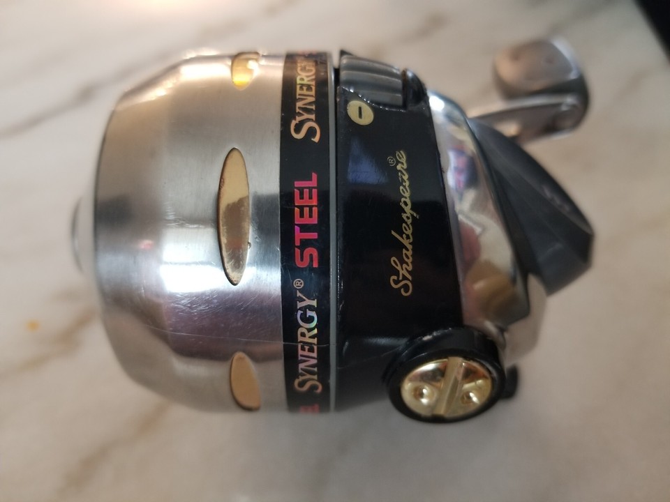 SHAKESPEARE SYNERGY STEEL SYN2001S10 SPINCAST CASTING REEL GOOD USED ...