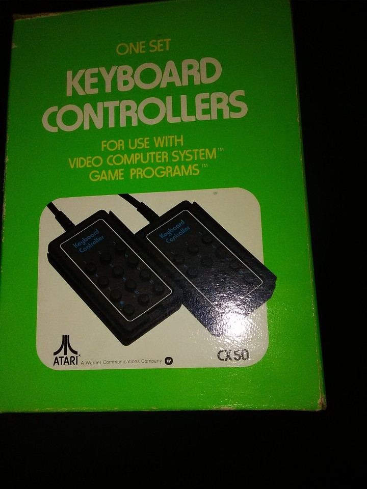 Atari 2600 functional console which includes controllers, adapters and ...