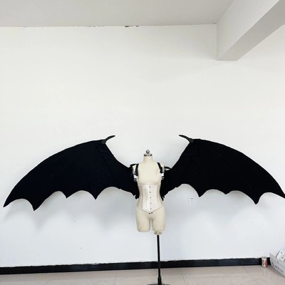 Black motorized retractable bat-shaped mechanical wings fashion show ...