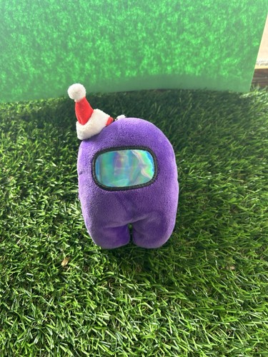 Among Us plush toy, specifically a purple crewmate wearing a Santa hat ...