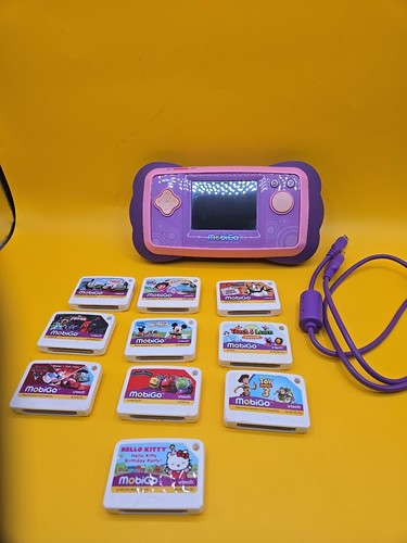 Vtech MobiGo Touch Learning System with 10 Games Dora Cars Mickey Exc ...