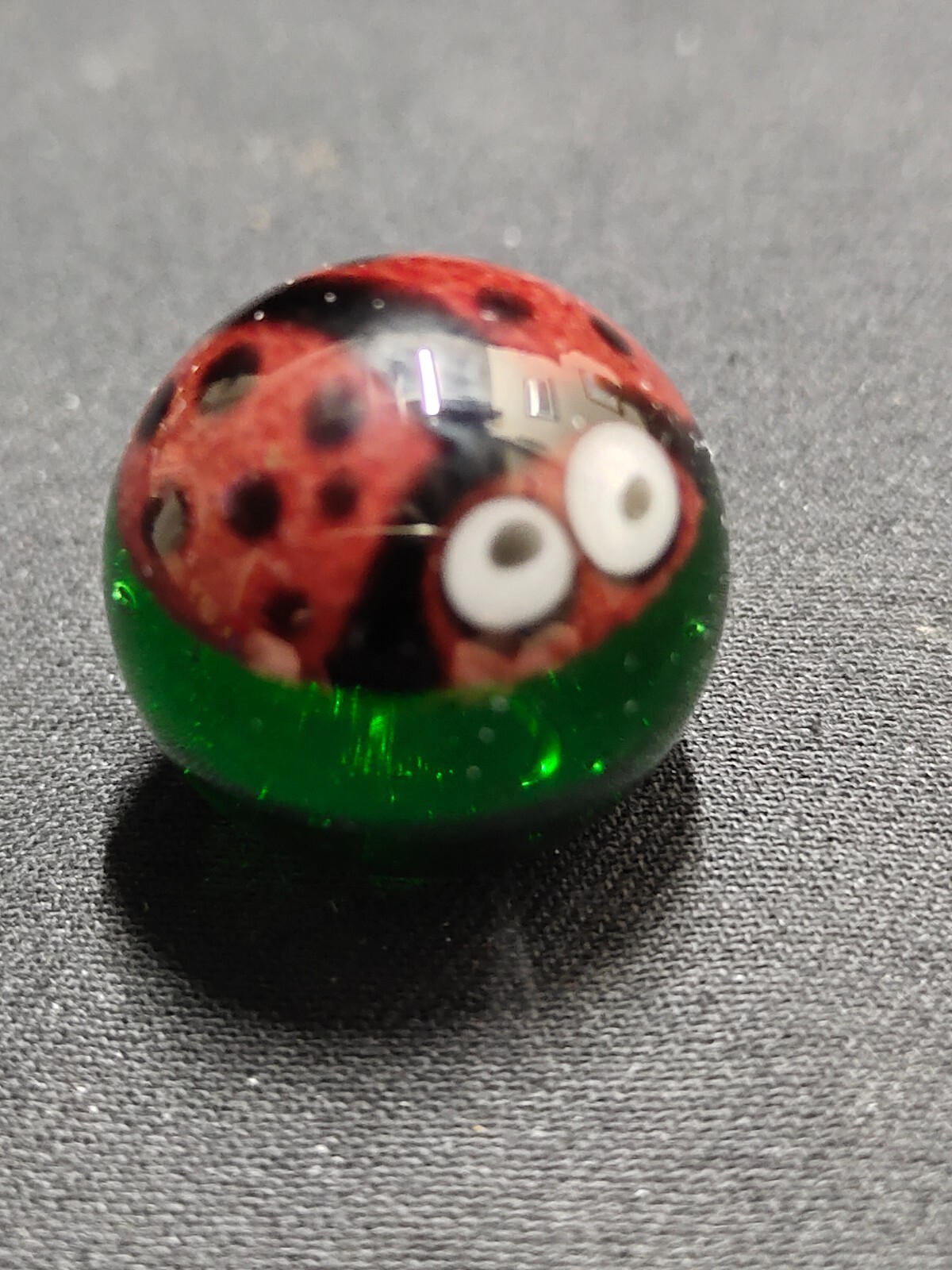 Ladybug on green small handmade borosilicate glass marble.Dr Sawfish ...