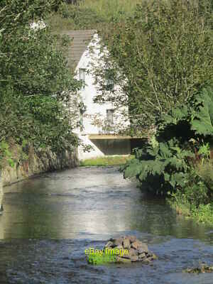 Photo 12x8 River Solva The river emerges from its steep-sided valley ...