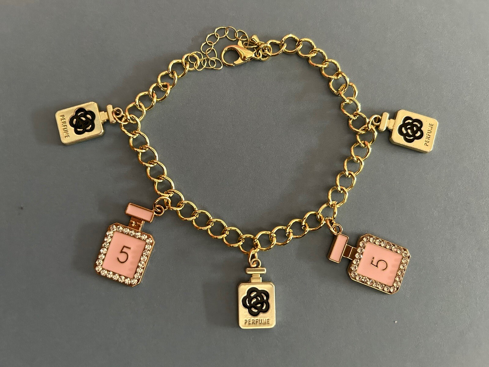 pink, black & gold parfum/perfume charm bracelet on 8.5" adj chain ...