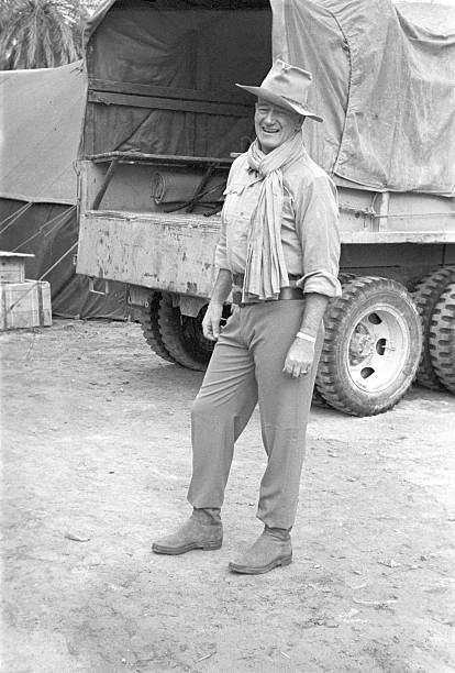 John Wayne smiling on the set of the film Legend of the Lost 1957 OLD ...